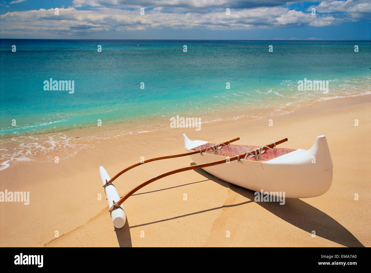 White Outrigger Canoe On Shoreline With Shadow, Calm Turquoise Water ...