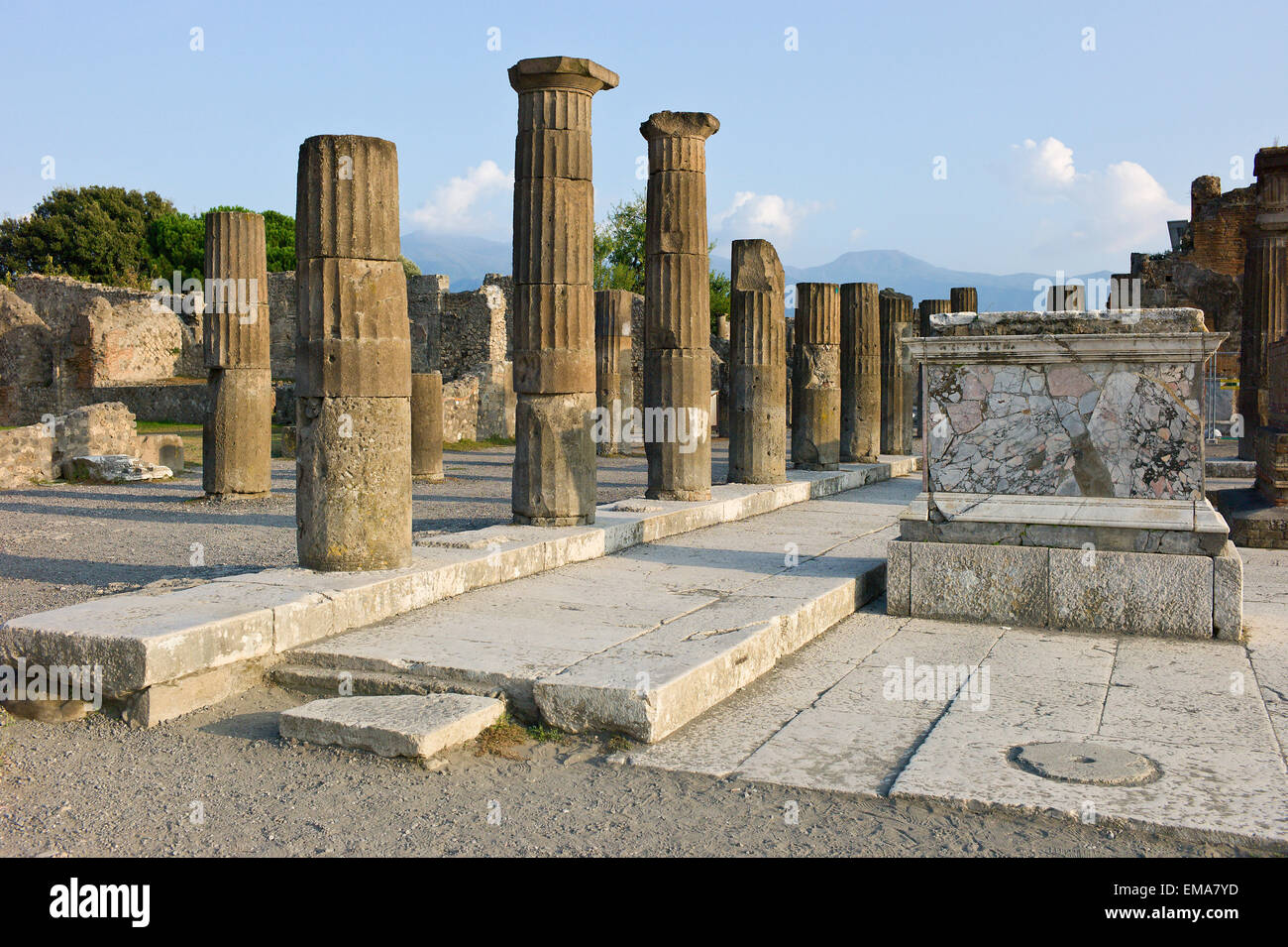 Pompeii, Italy. Stone columns and monuments in the ruins of the archaeological excavations of ...