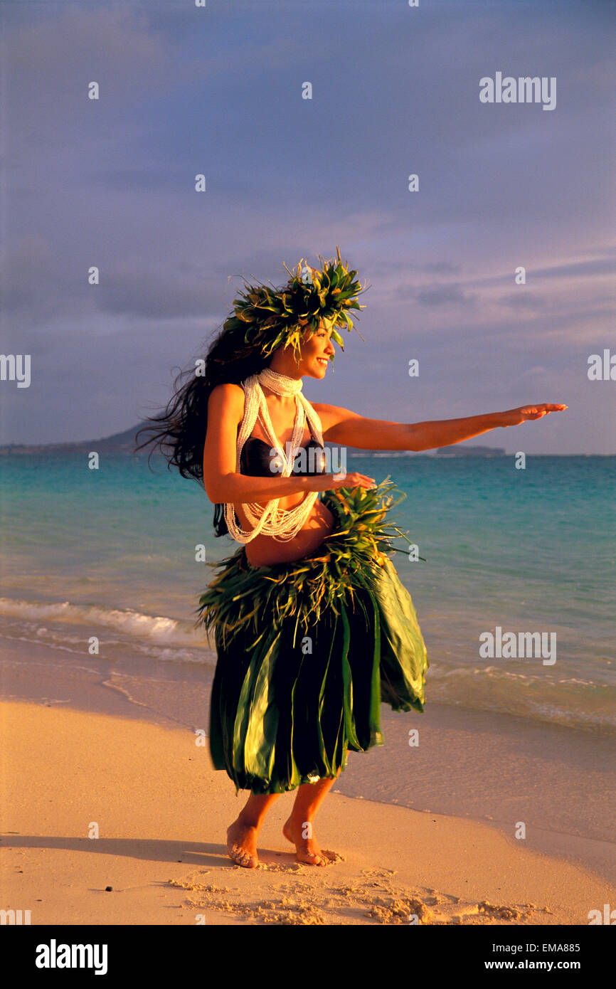 Young Woman Hula On Beach At Sunrise With Coconut Top, Haku Ti Leaf ...