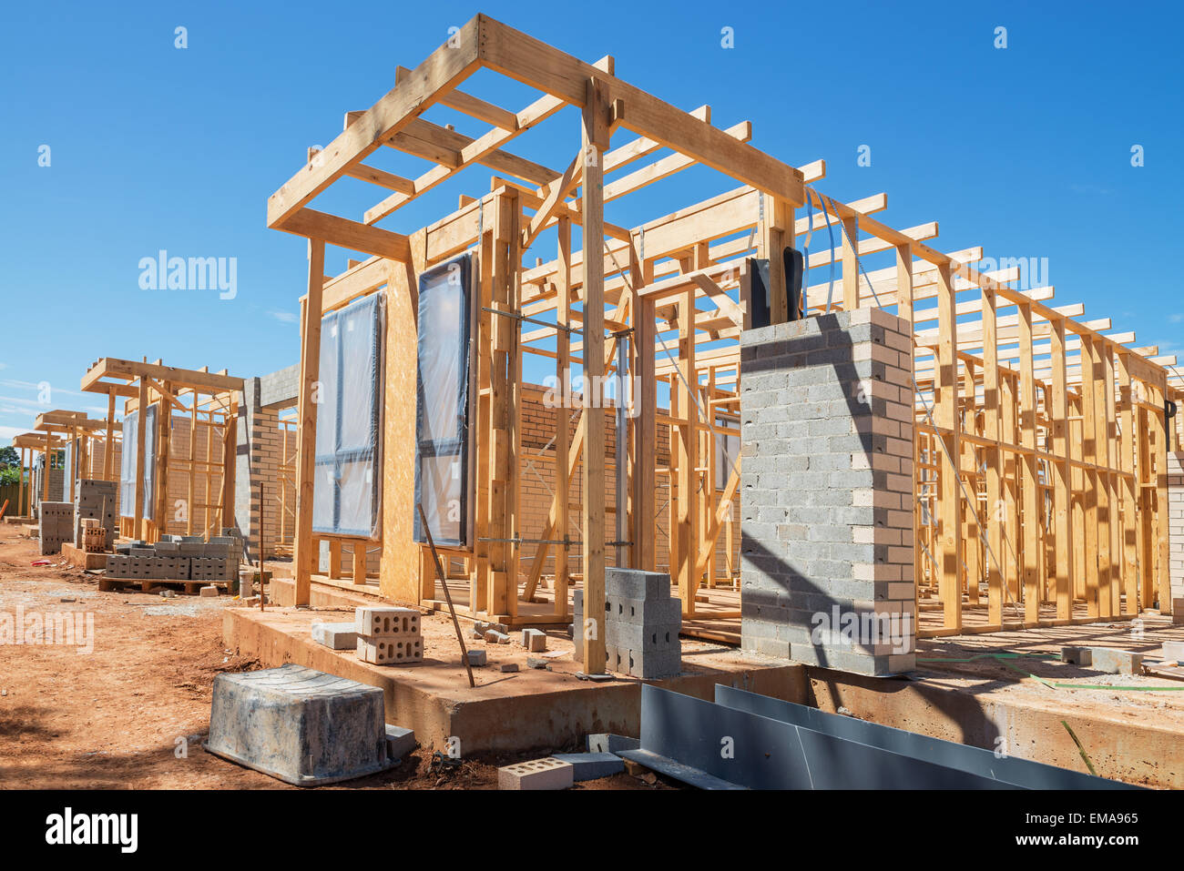 new suburban homes currently under construction in row Stock Photo - Alamy