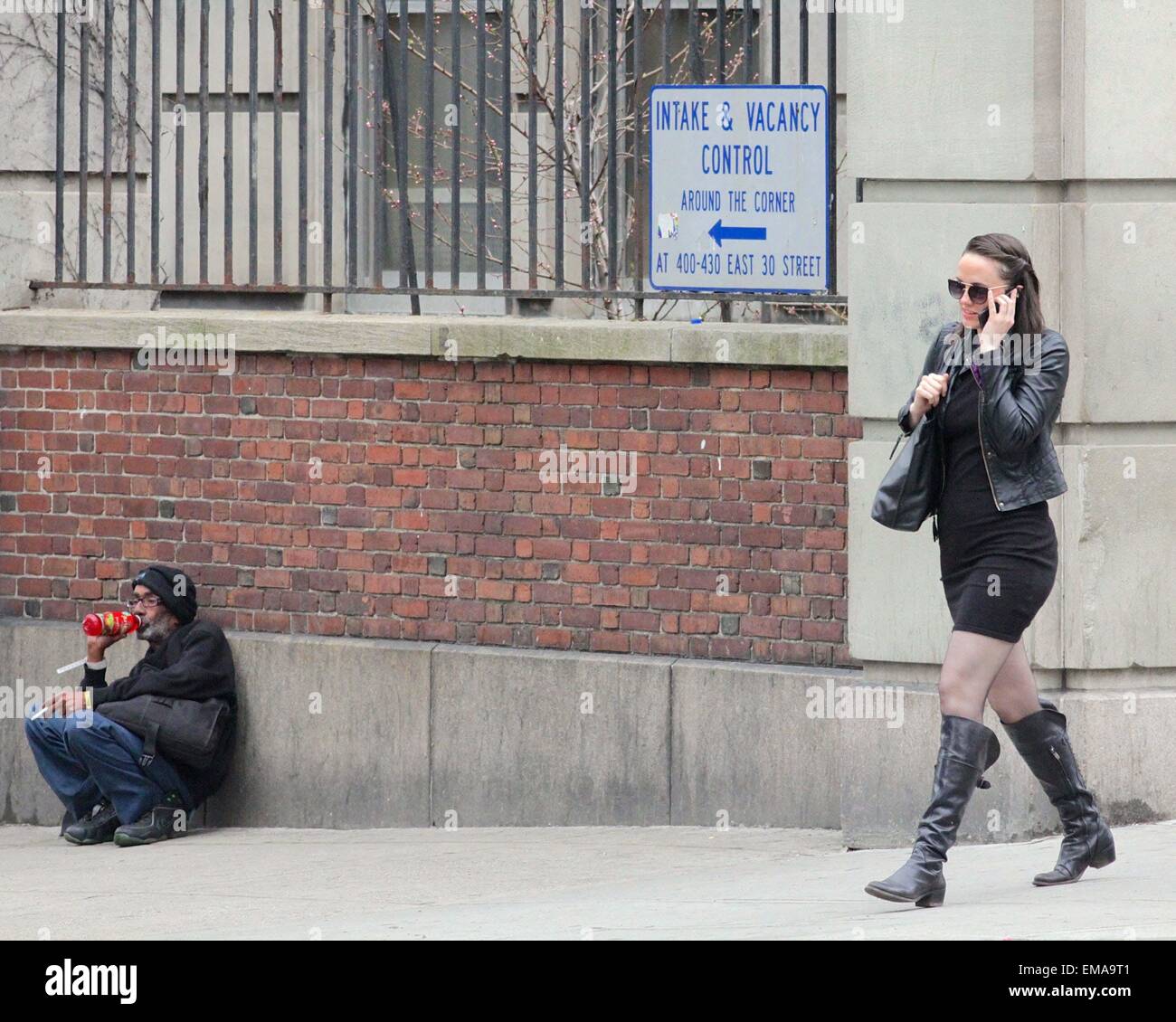 New York, New York, USA. 4th Apr, 2015. A woman passes by the HRA men's ...