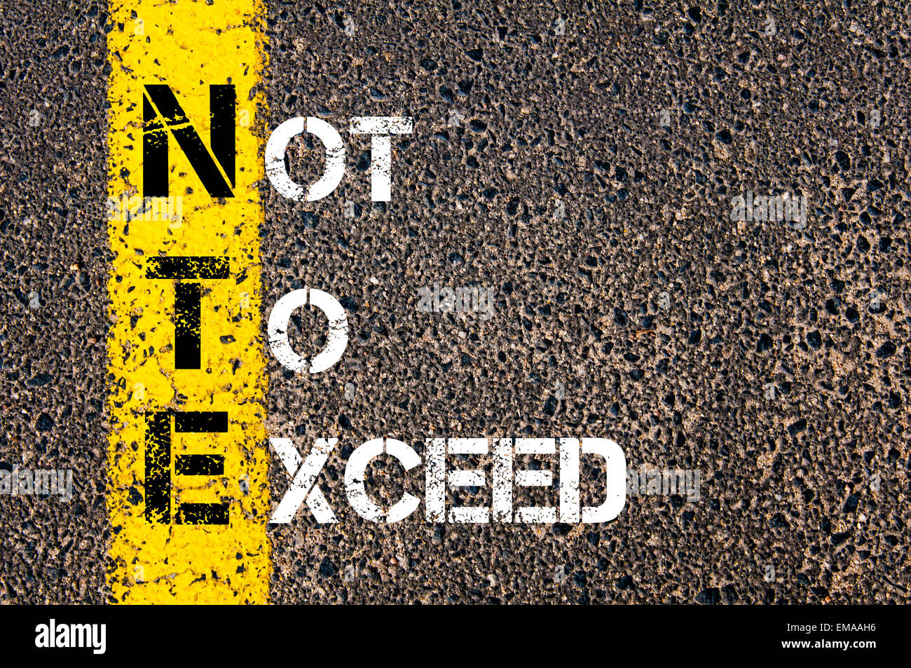 Business Acronym NTE - Not To Exceed. Yellow paint line on the road ...