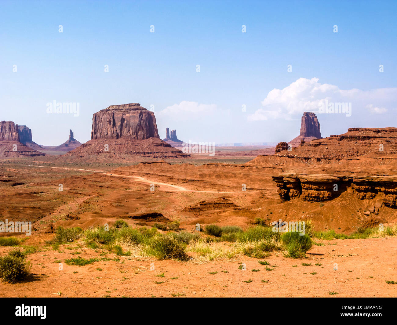 giant sandstone buttes in the Monument valley under blue sky Stock ...