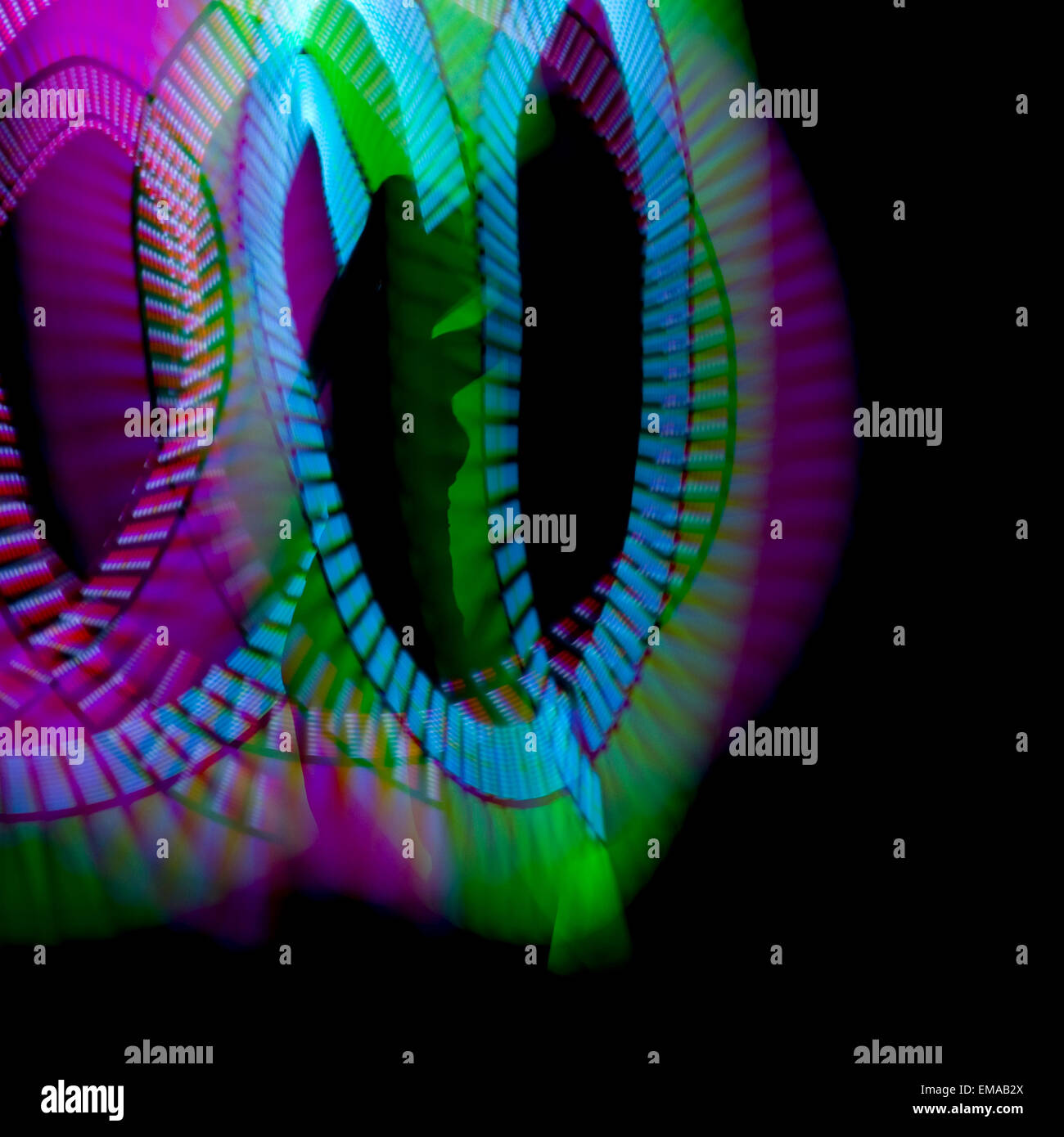 "Feeding the Fish" performer dancing with LED lights Stock Photo - Alamy