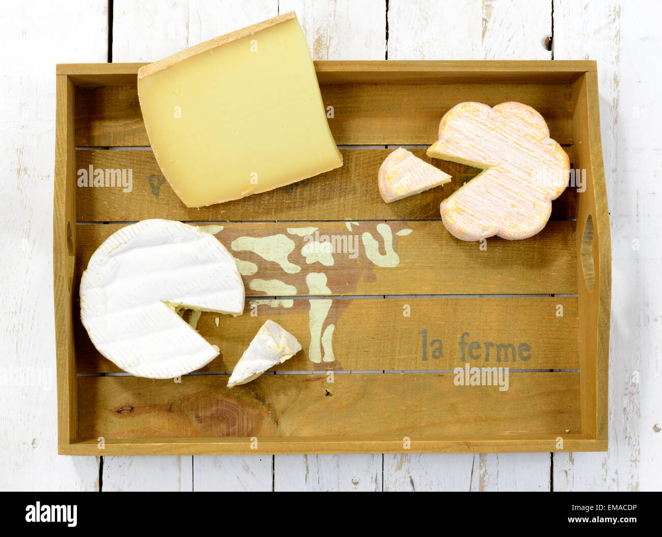 tray different french cheeses on white wooden table Stock Photo - Alamy