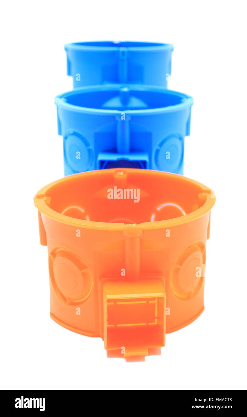 Orange and blue plastic electrical boxes on white background, junction ...
