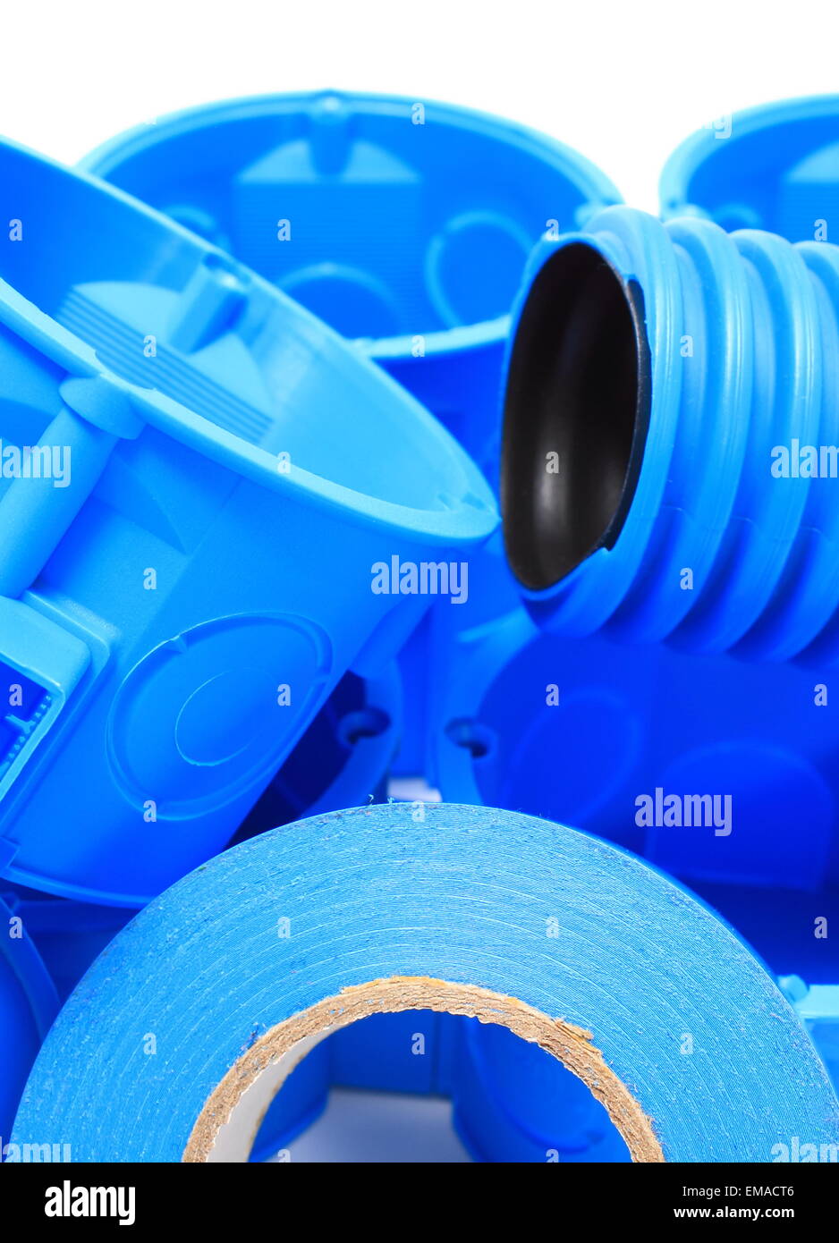 Heap of blue electrical boxes and components for use in electrical ...