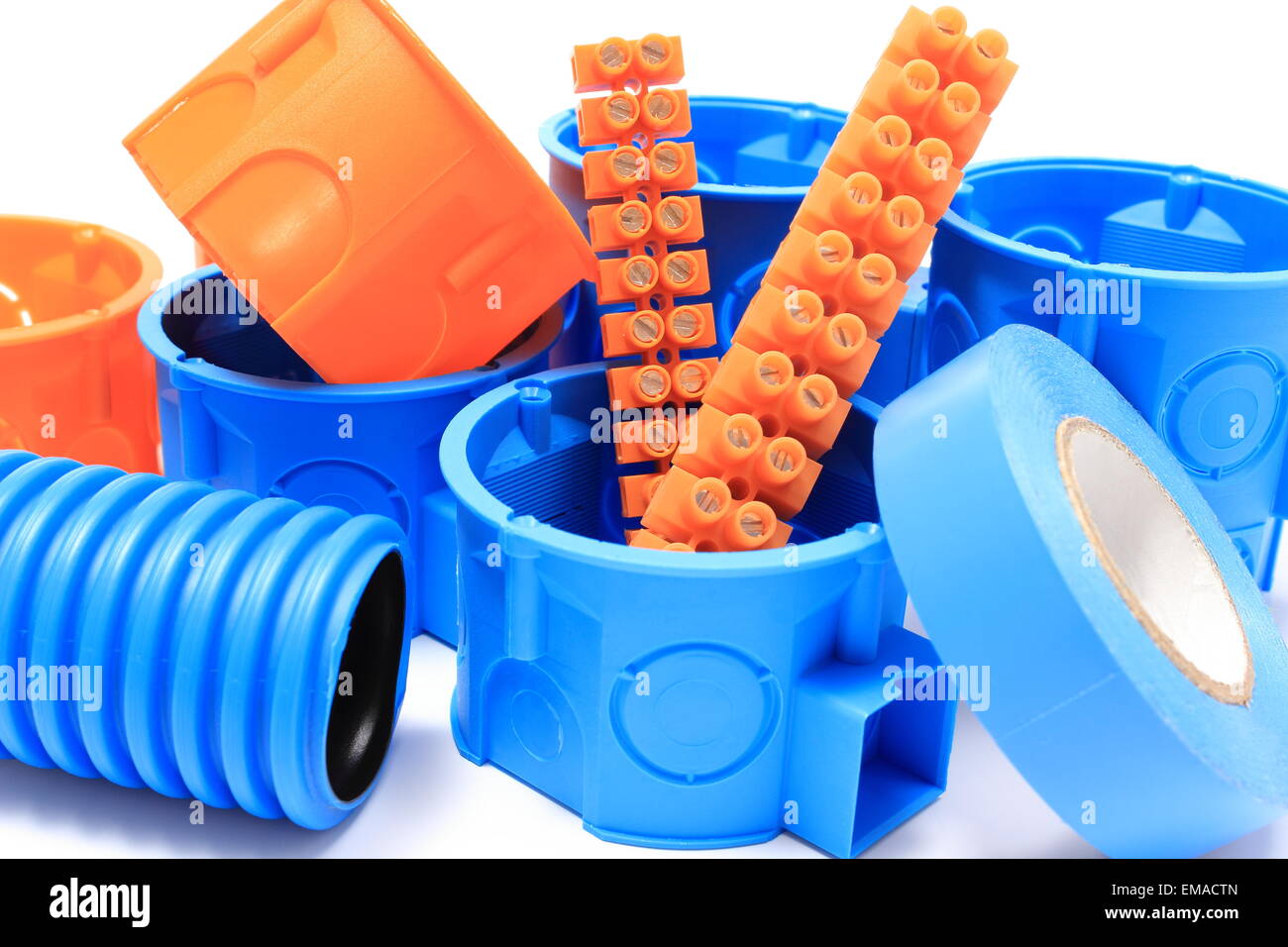 Orange and blue electrical boxes with components for use in electrical ...