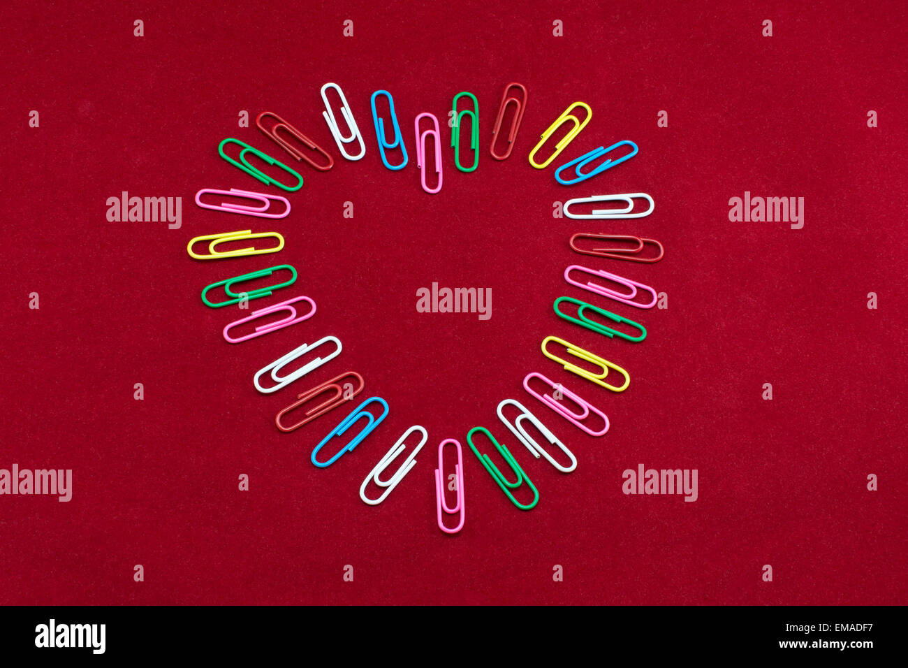 Coloured paper clips arranged to form the shape of a heart Stock Photo ...