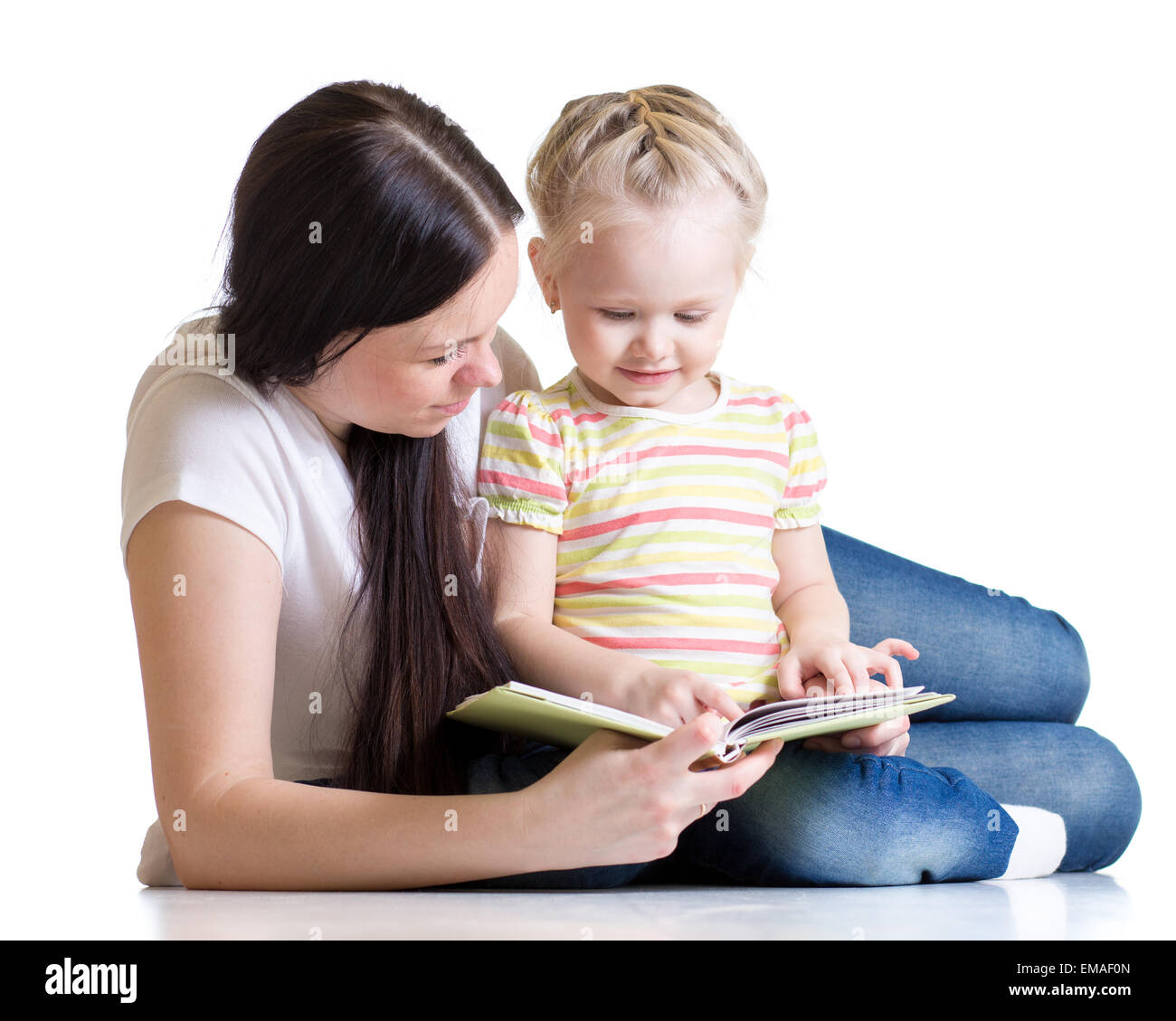 Smiling girl reading book mother hi-res stock photography and images ...