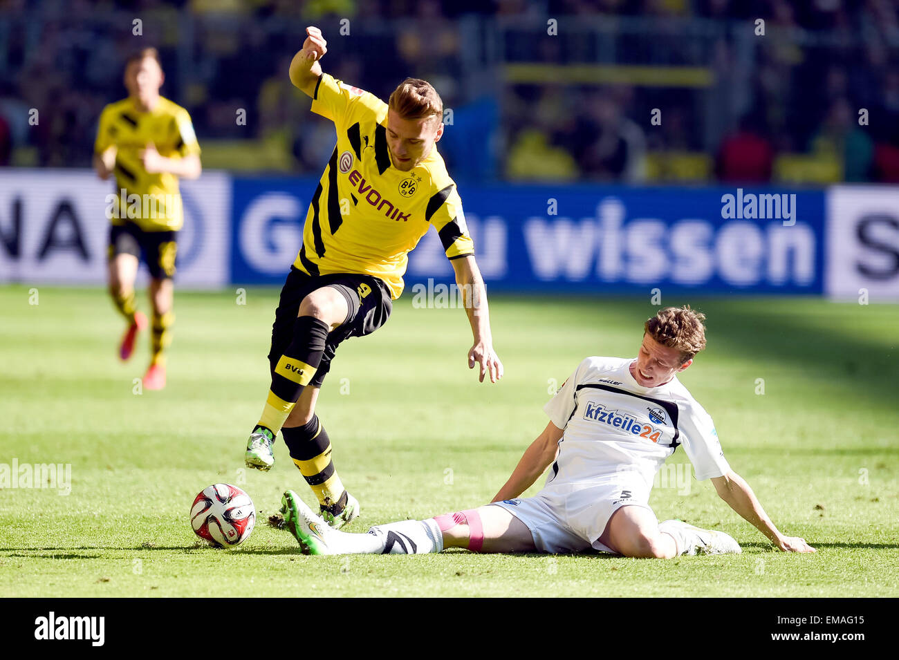 Dortmund, Germany. 18th Apr, 2015. Dortmund's Ciro Immobile (L) and Paderborn's Patrick Ziegler ...