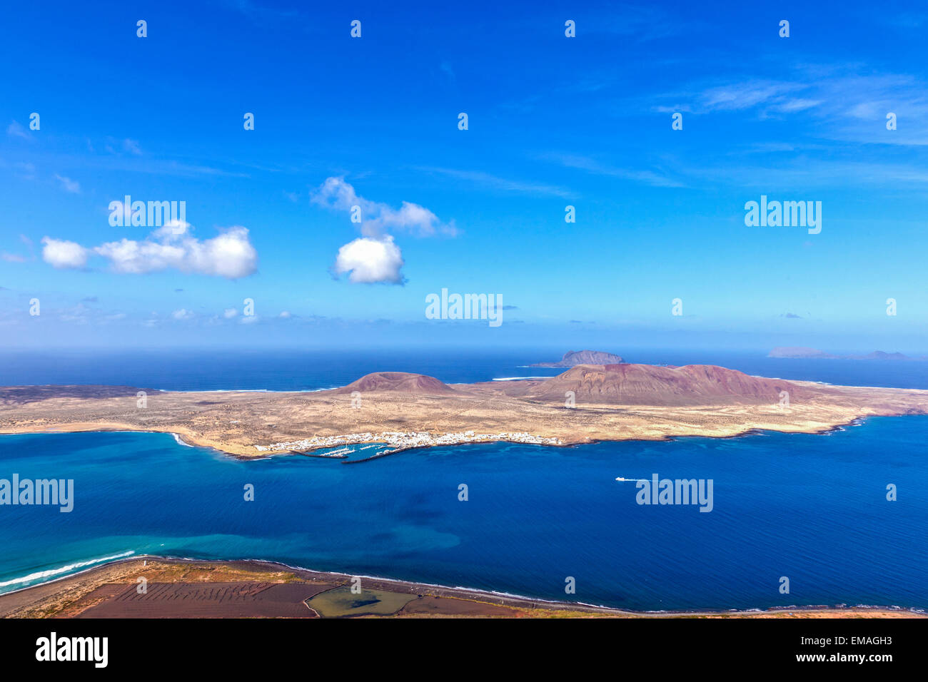 The Island of La Graciosa and the port of Caleta del Sebo taken from ...