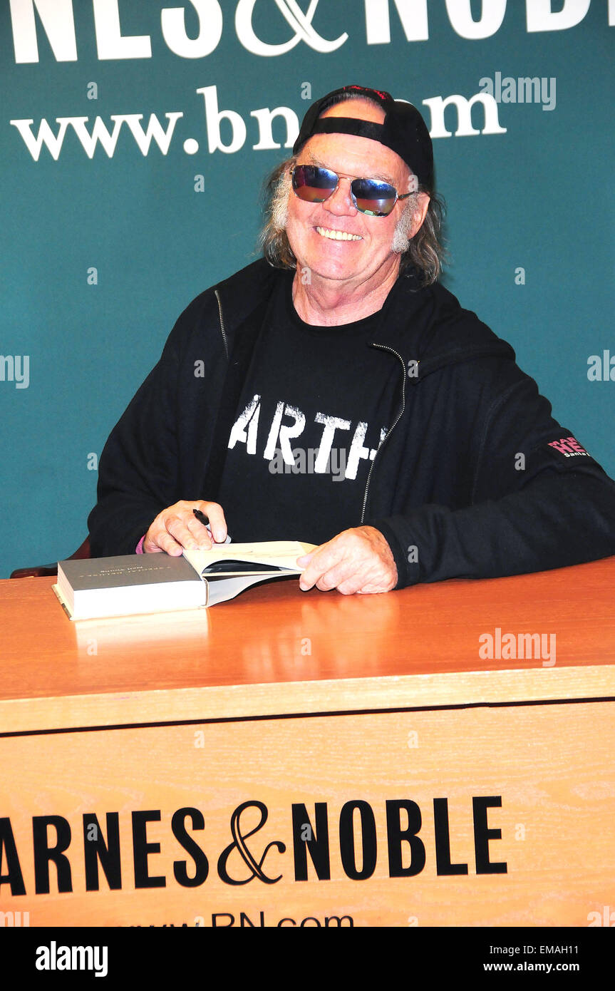 Neil young signs copies of his book hi-res stock photography and images ...