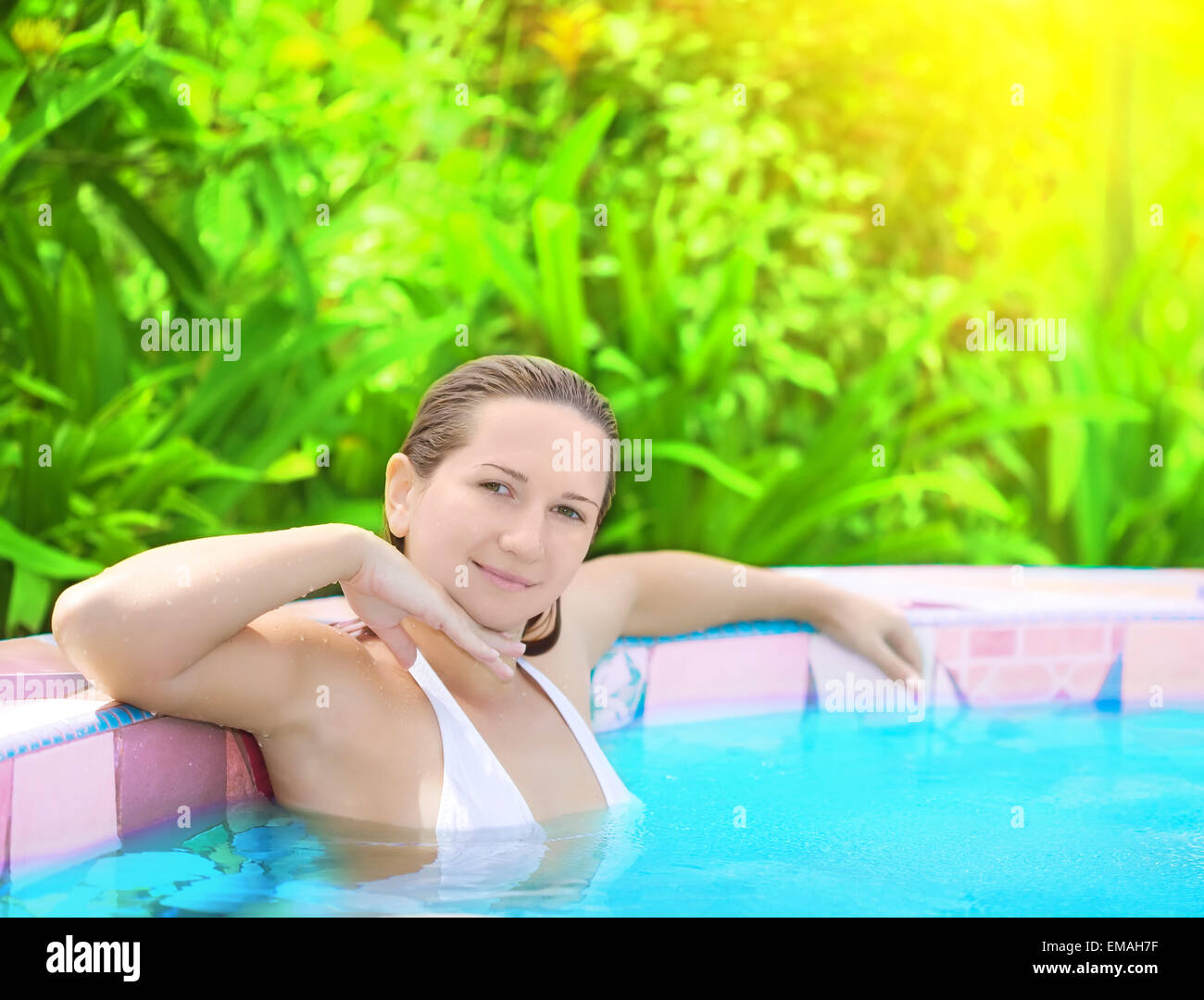 Young woman relaxing in Jacuzzi outdoor Stock Photo - Alamy