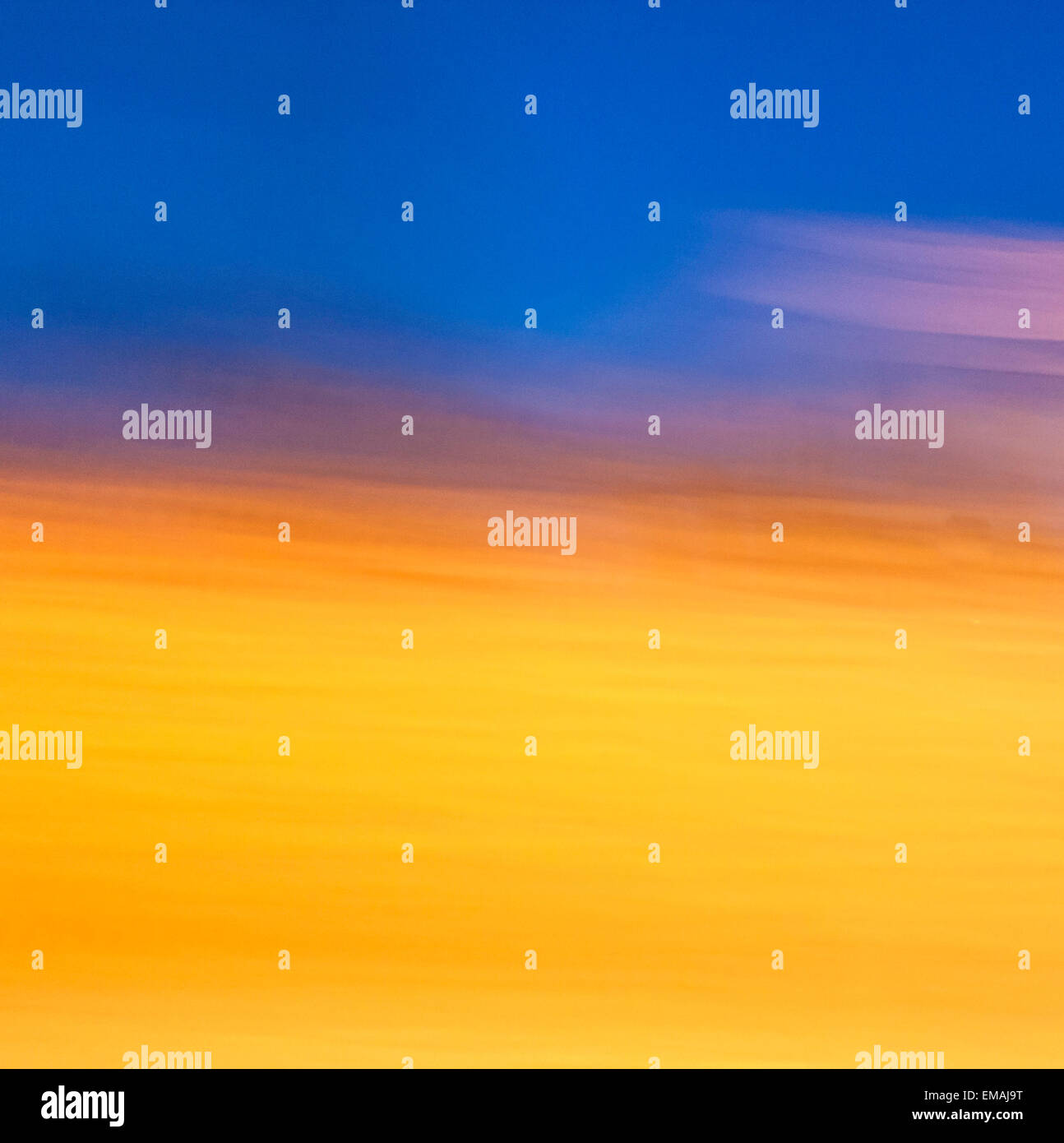 blue and golden sunset gives a harmonic background Stock Photo - Alamy