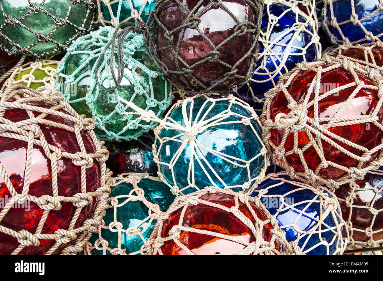 colorful balls of glass with rope Stock Photo - Alamy