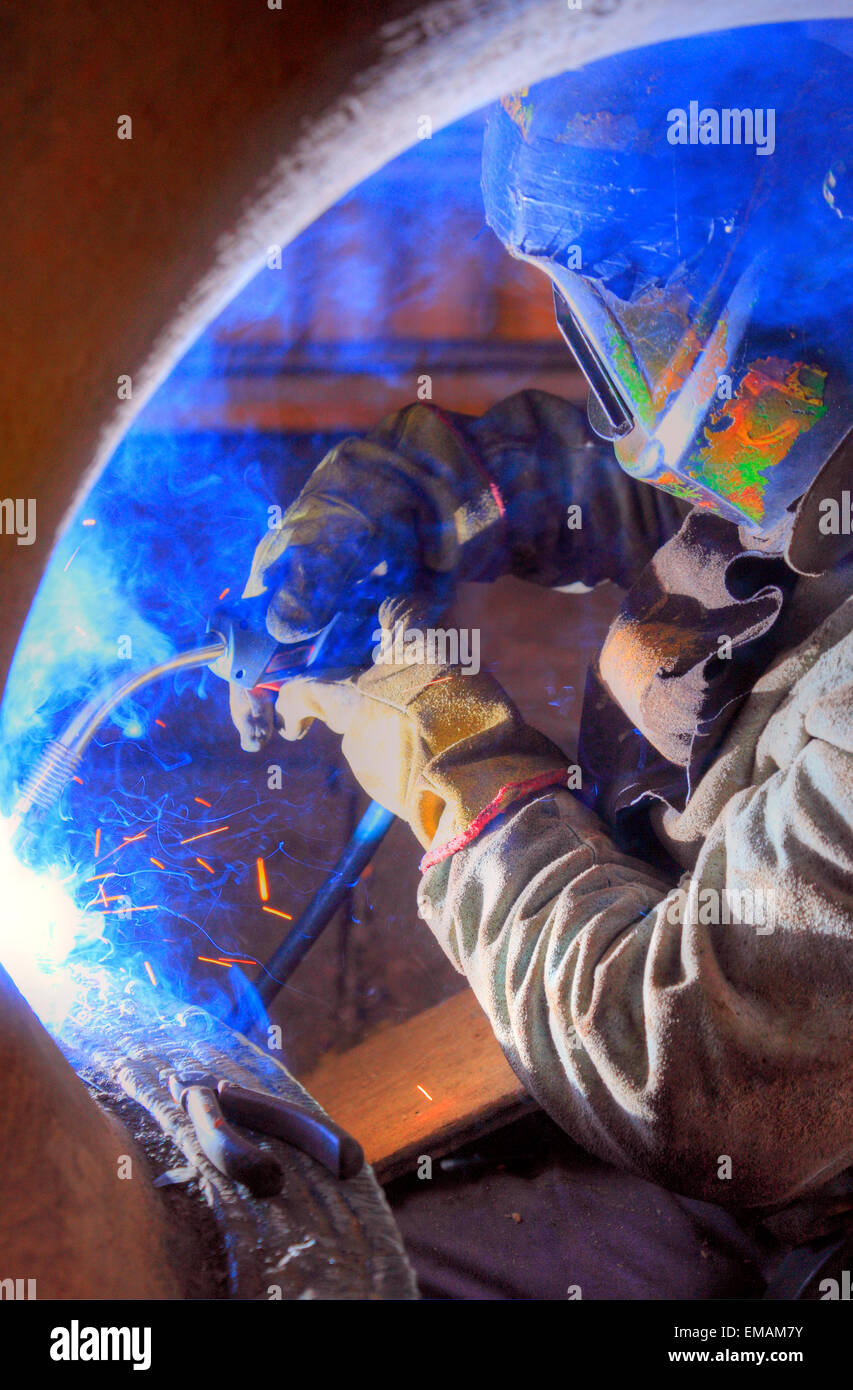 Welding workers at Demarchi Island Port, River Plate Coast. Buenos ...