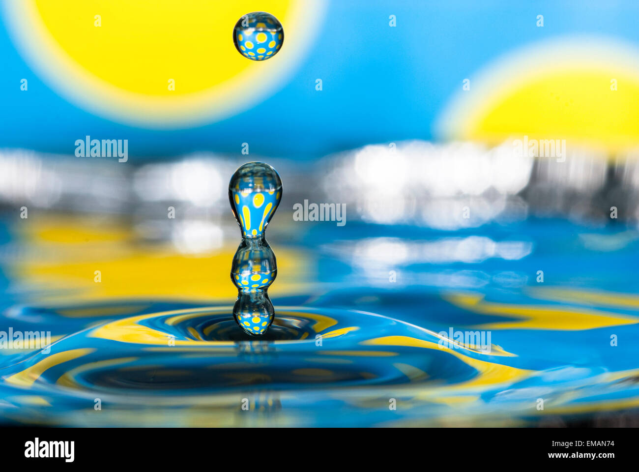 Water Drop Splash with Blue and Yellow Polka Dot background Stock Photo ...