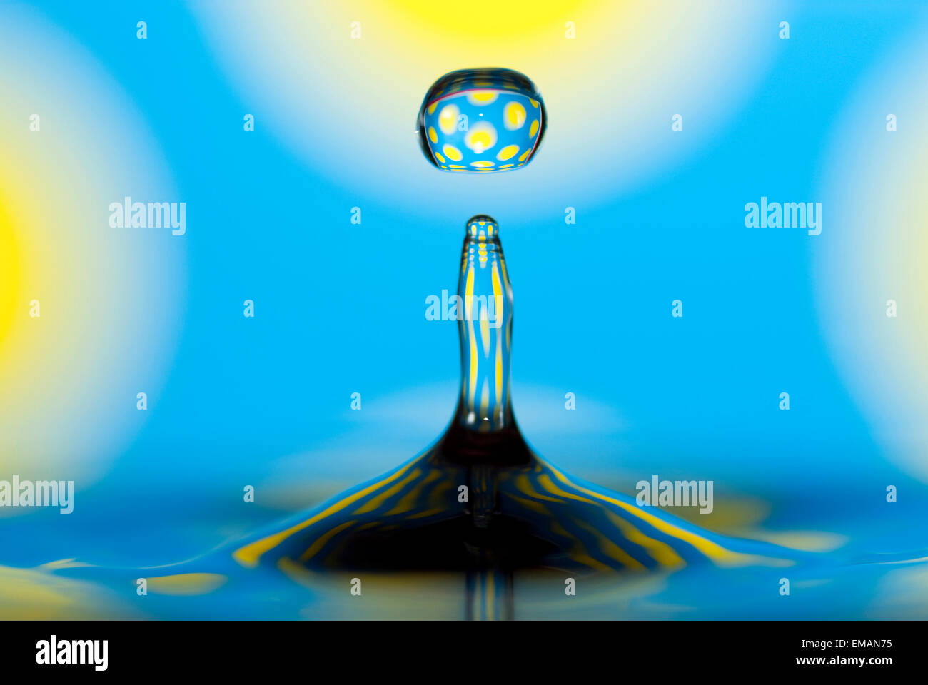 Water Drop Splash with Blue and Yellow Polka Dot background Stock Photo ...