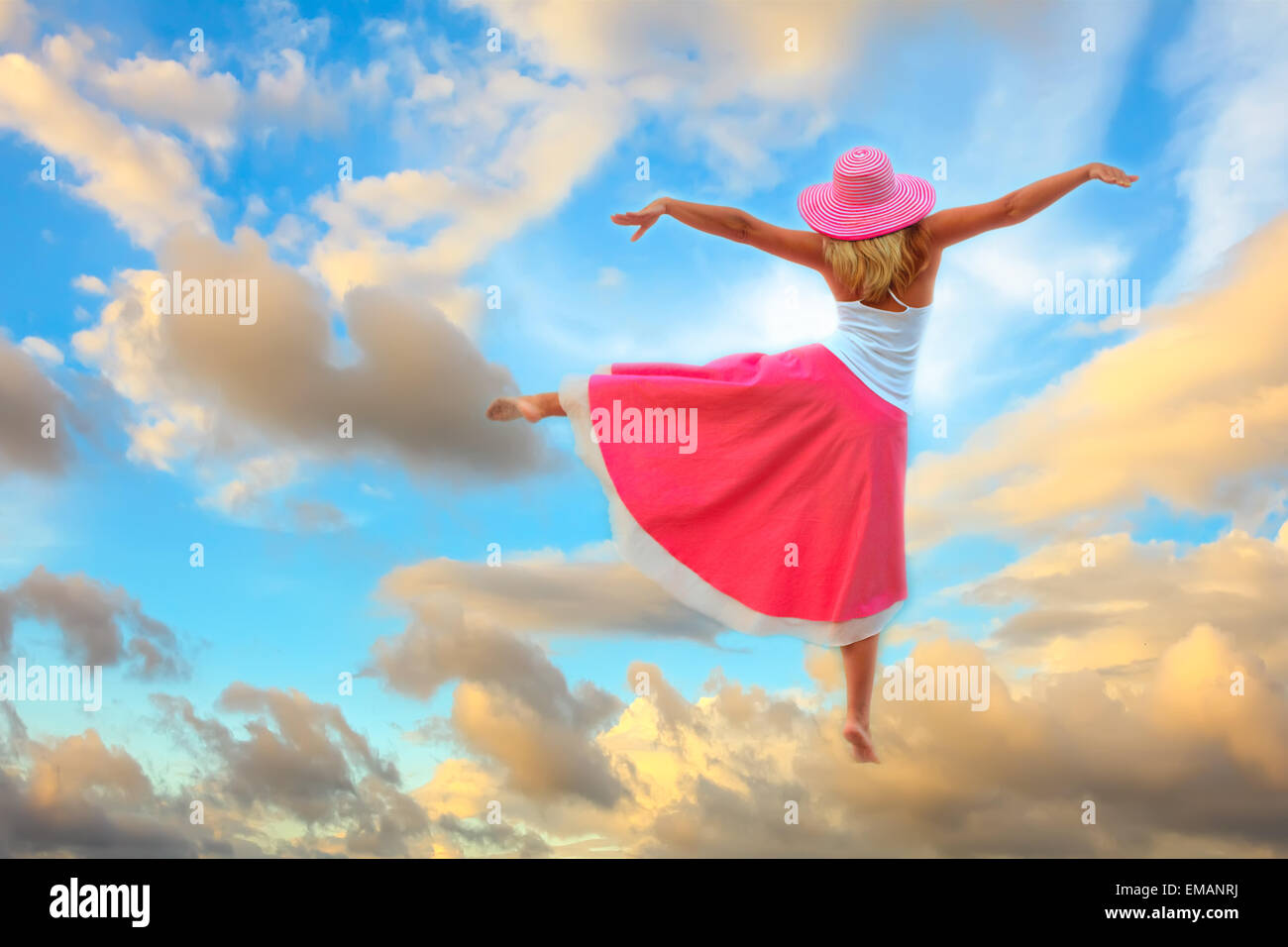 Woman dancing in the sky on cloud Stock Photo - Alamy