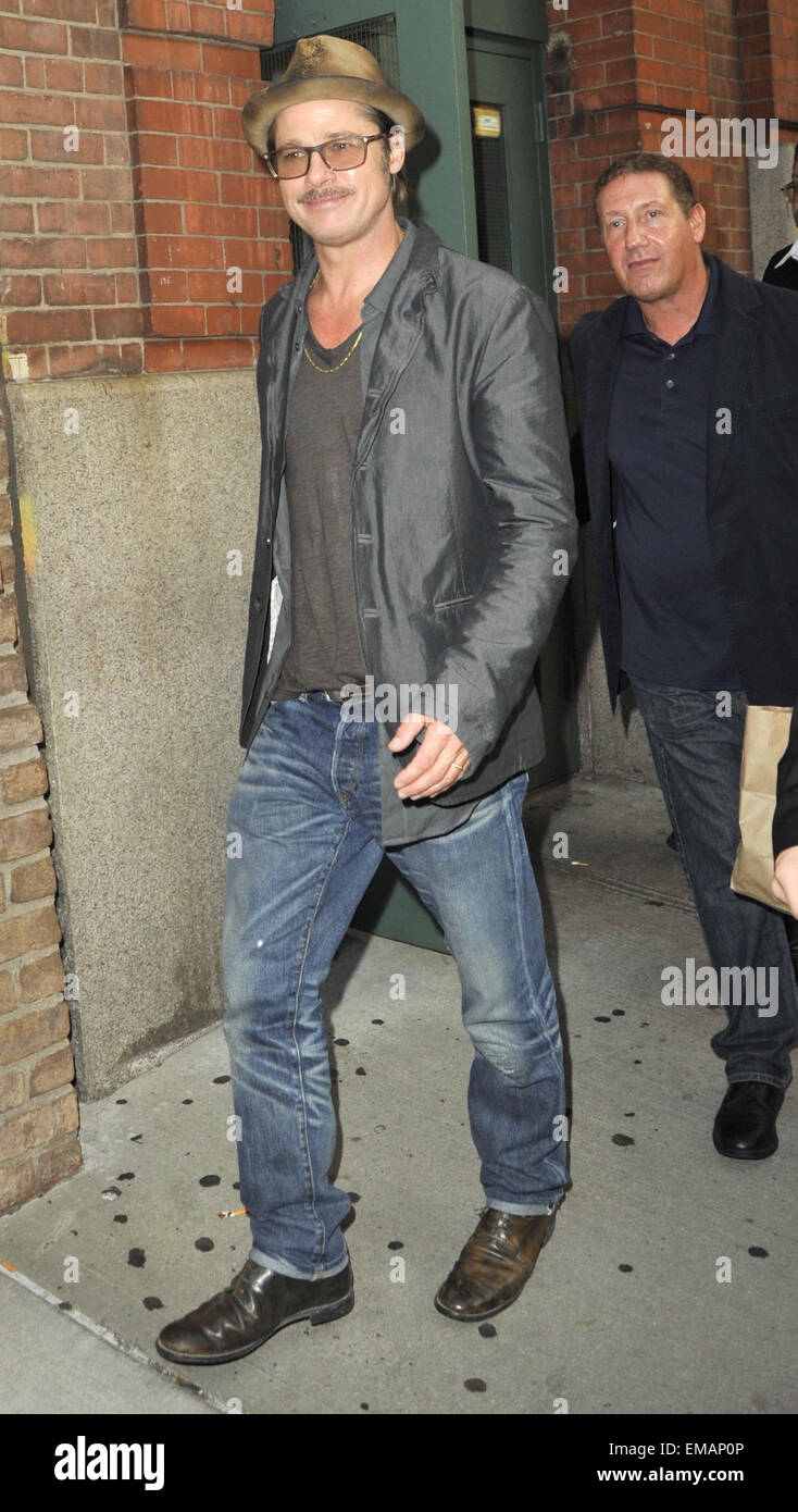Brad Pitt out and about in New York City wearing a hat and glasses ...