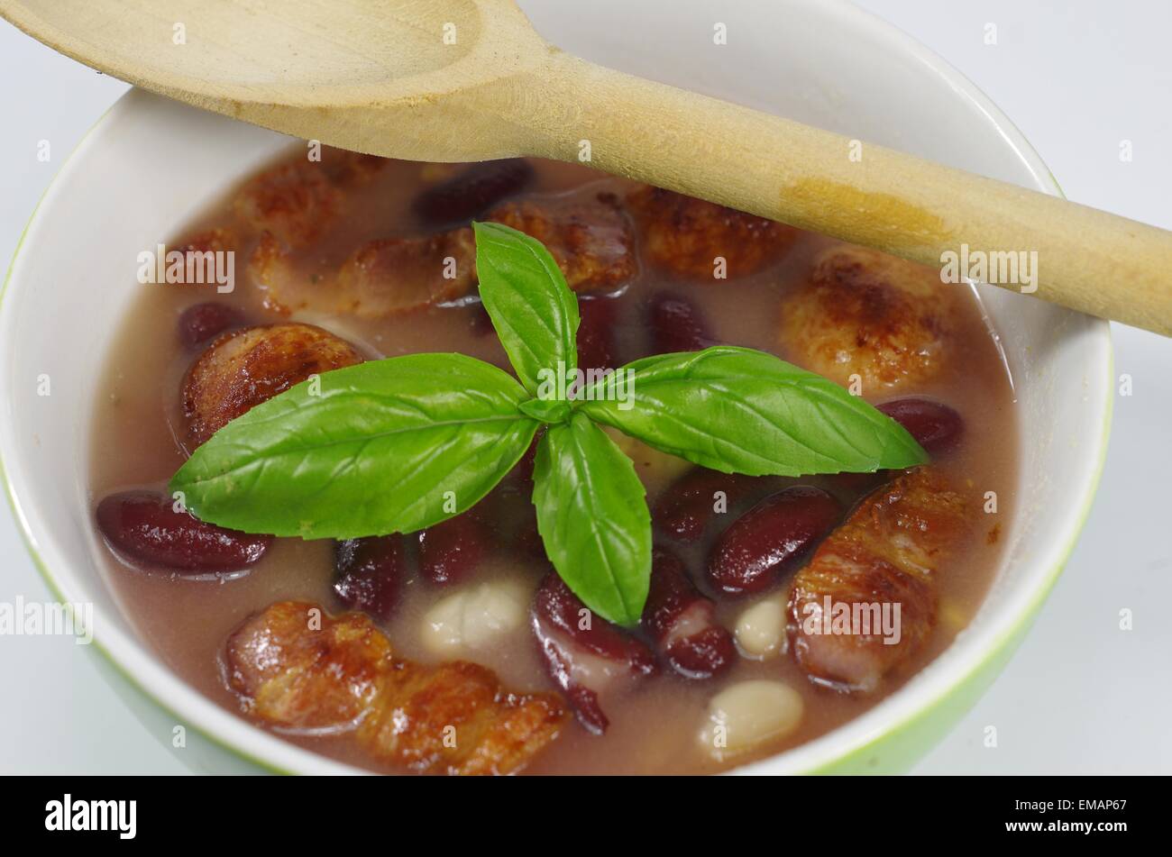 appetizing bean soup with meat and basil Stock Photo - Alamy