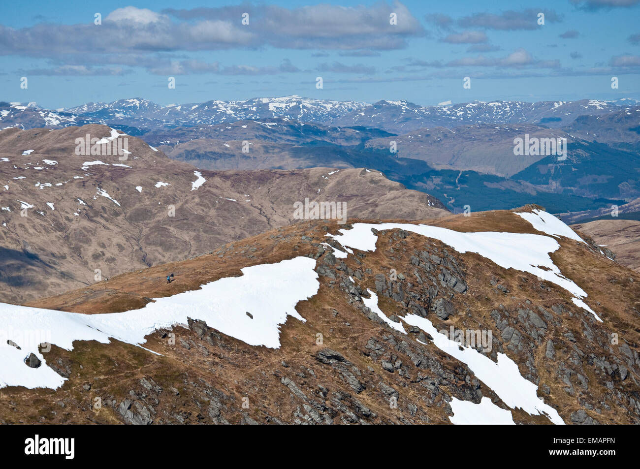Two hikers walking along a northern ridge from the Ben Ledi mountain ...