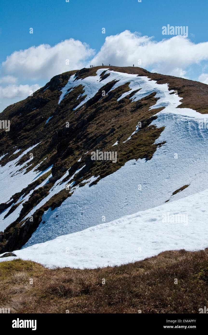 Summit of Ben Ledi mountain with snow on the ridge. Trossachs National ...