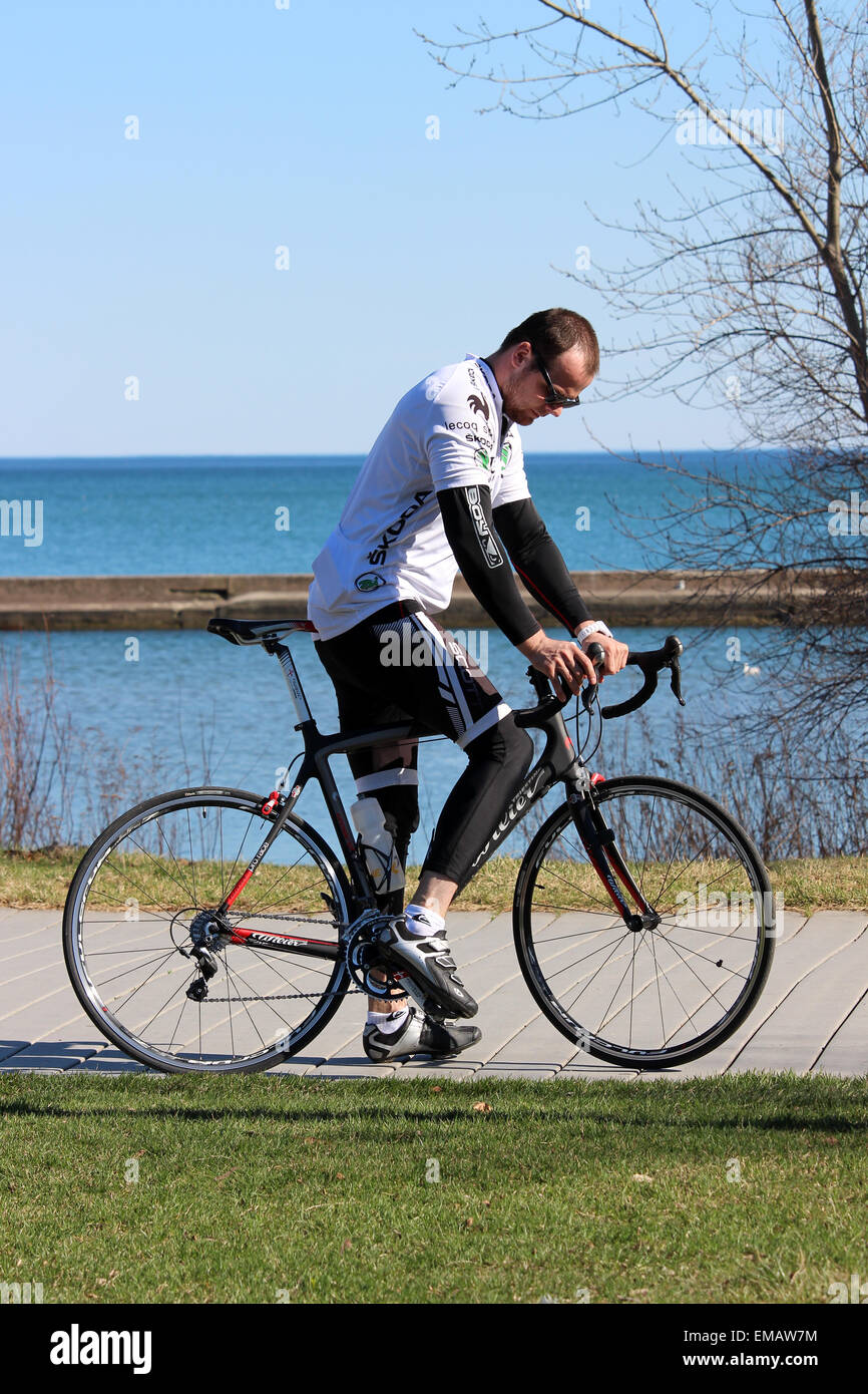 Male cyclist stopping to rest on boardwalk Stock Photo - Alamy