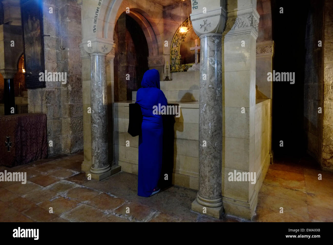A Christian devotee praying at the altar dedicated to Saint Helena in ...