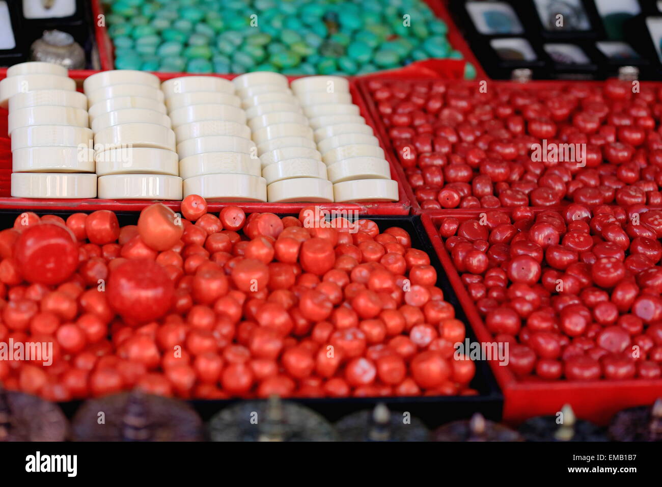 Colored plastic buttons an beads and trinkets for necklace making-shop ...