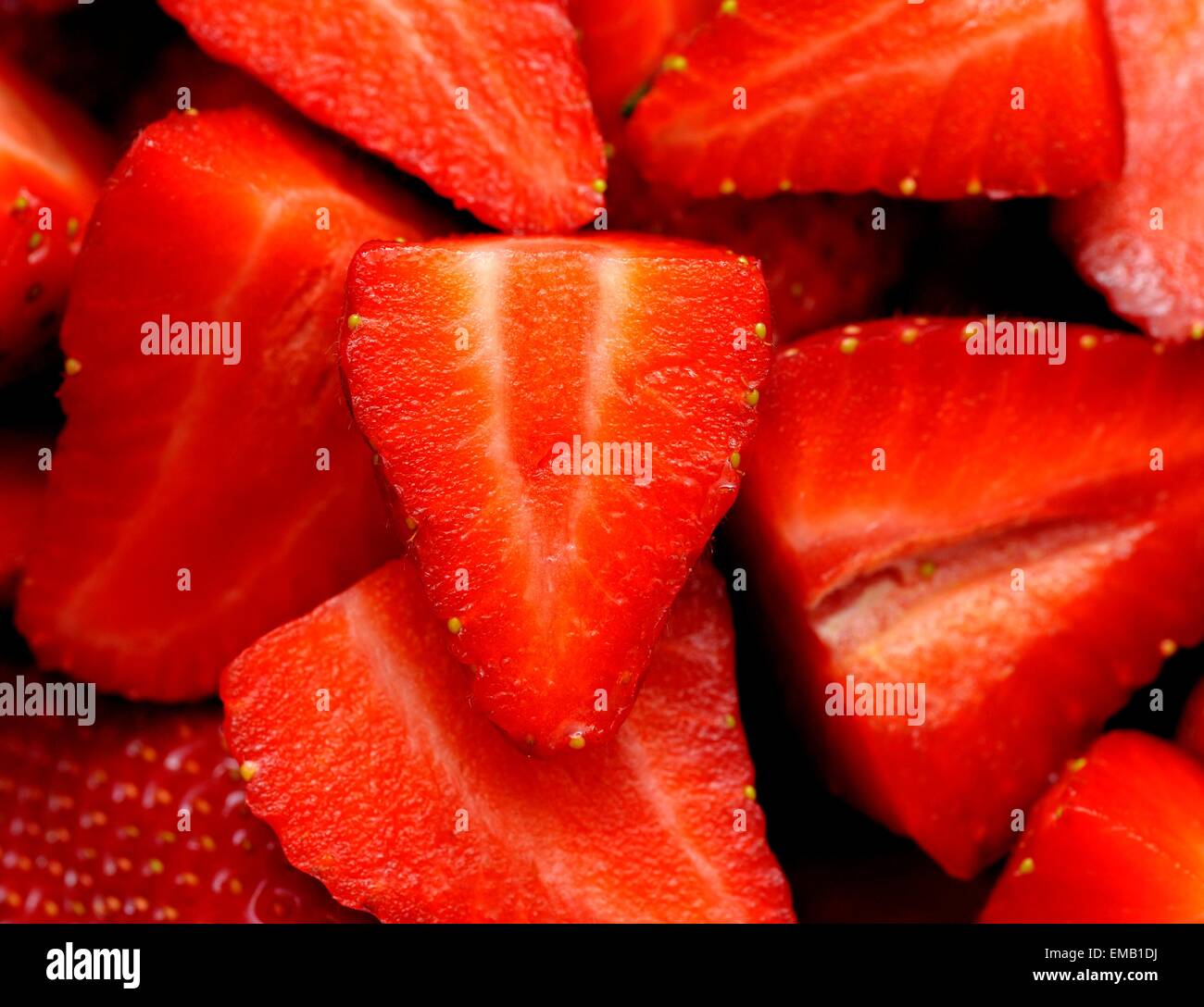Strawberries cut in pieces Stock Photo - Alamy