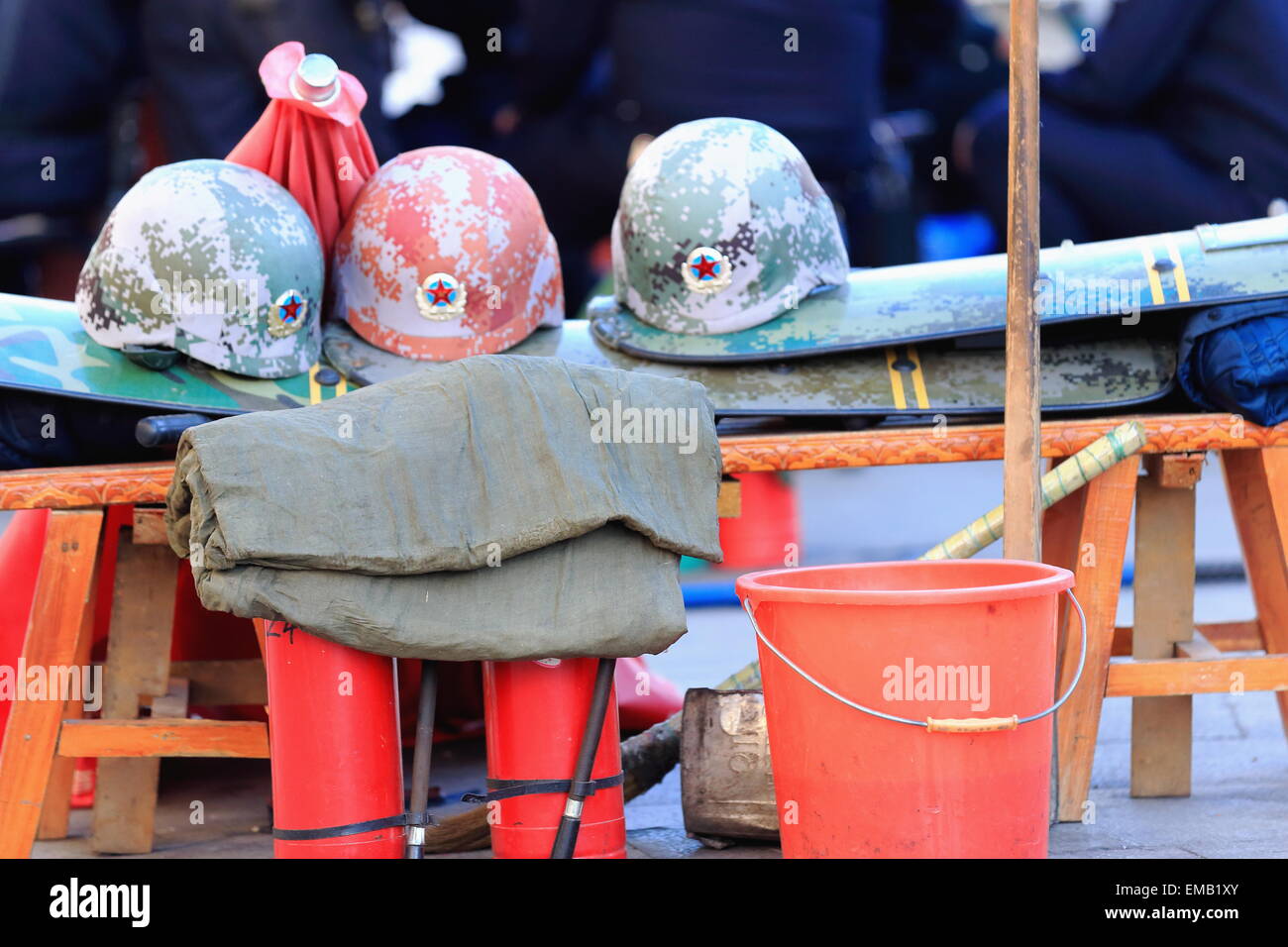 Chinese police helmets-shields resting on wooden bench while policemen ...