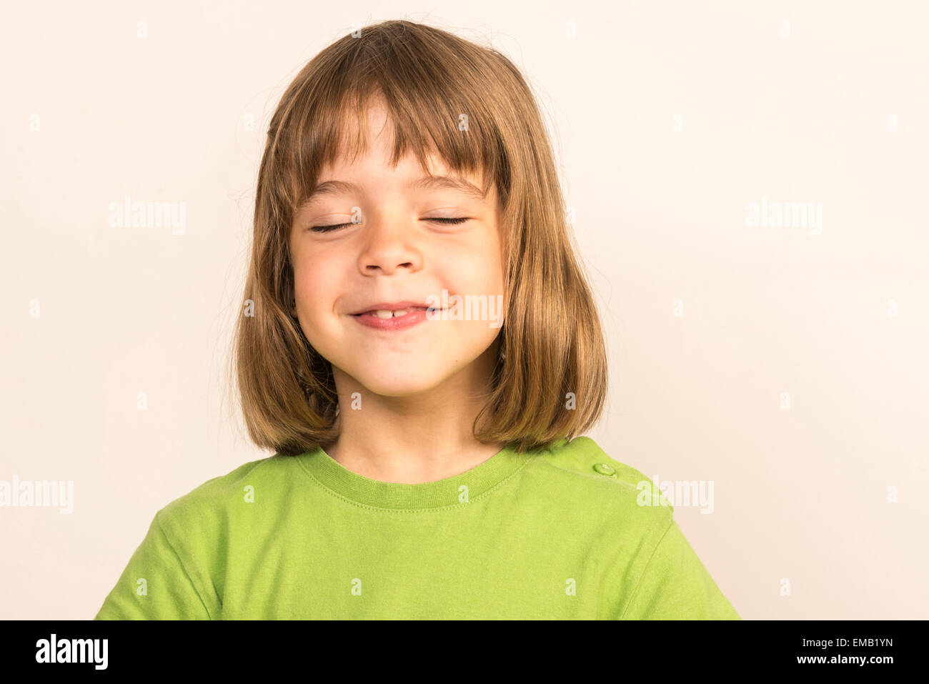 Girl smiling with eyes closed hi-res stock photography and images - Alamy