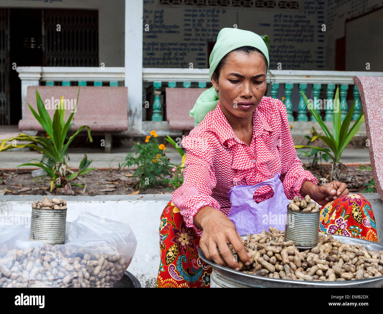 Cambodian woman selling peanuts Stock Photo - Alamy