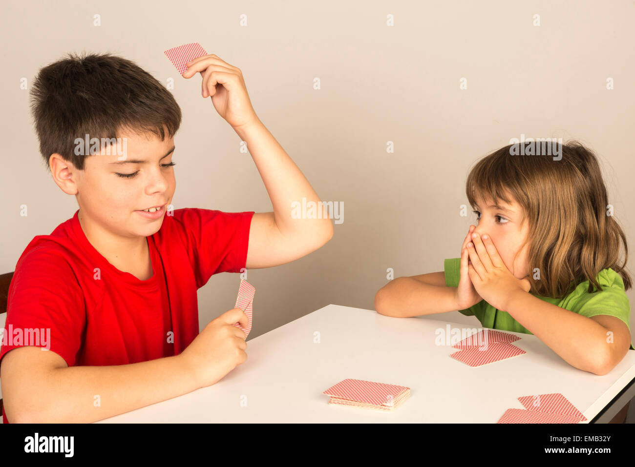 kids playing cards at home Stock Photo - Alamy