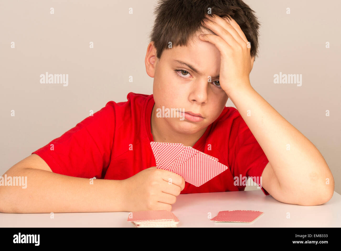 Angry child at table hi-res stock photography and images - Alamy