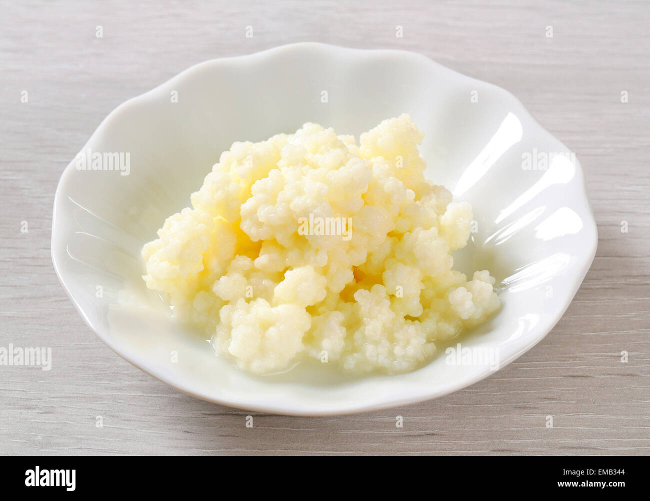 Organic probiotic milk kefir grains Stock Photo - Alamy