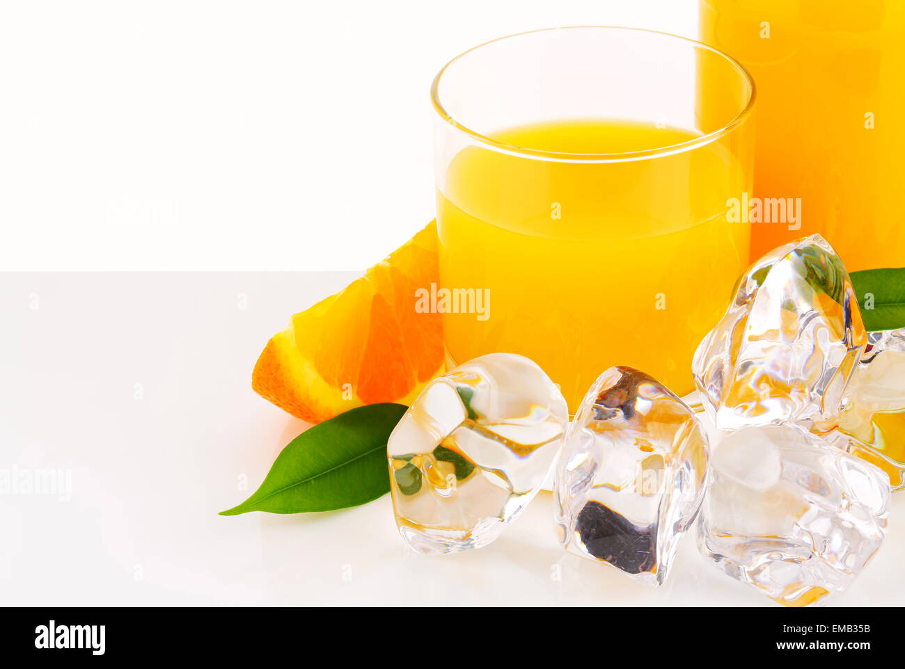 Fresh orange juice and ice Stock Photo - Alamy