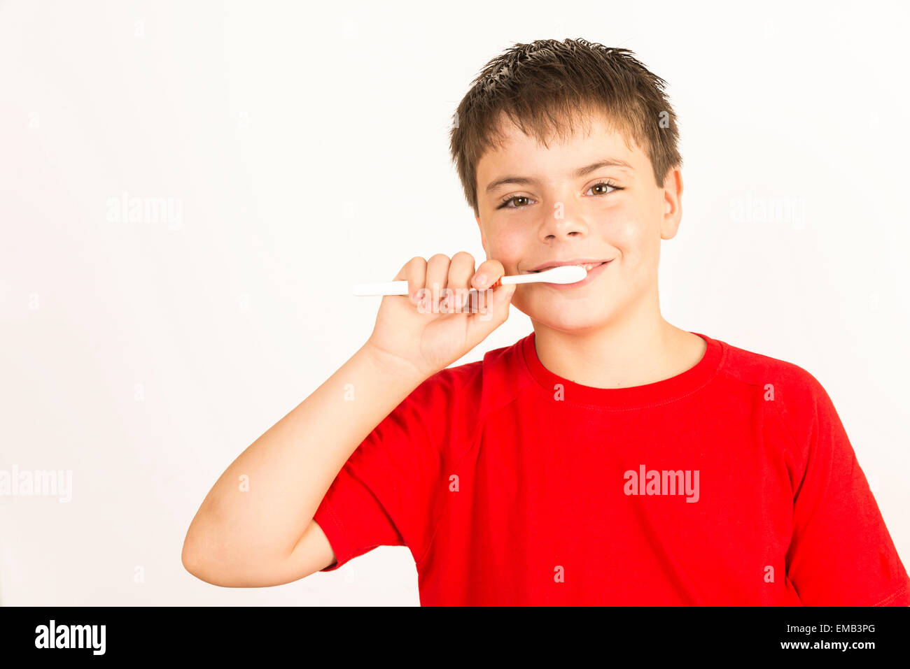 Portrait of a young boy brushing his teeth Stock Photo - Alamy