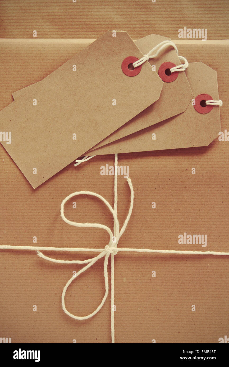 Parcel packing brown parcel paper labels and string Stock Photo - Alamy
