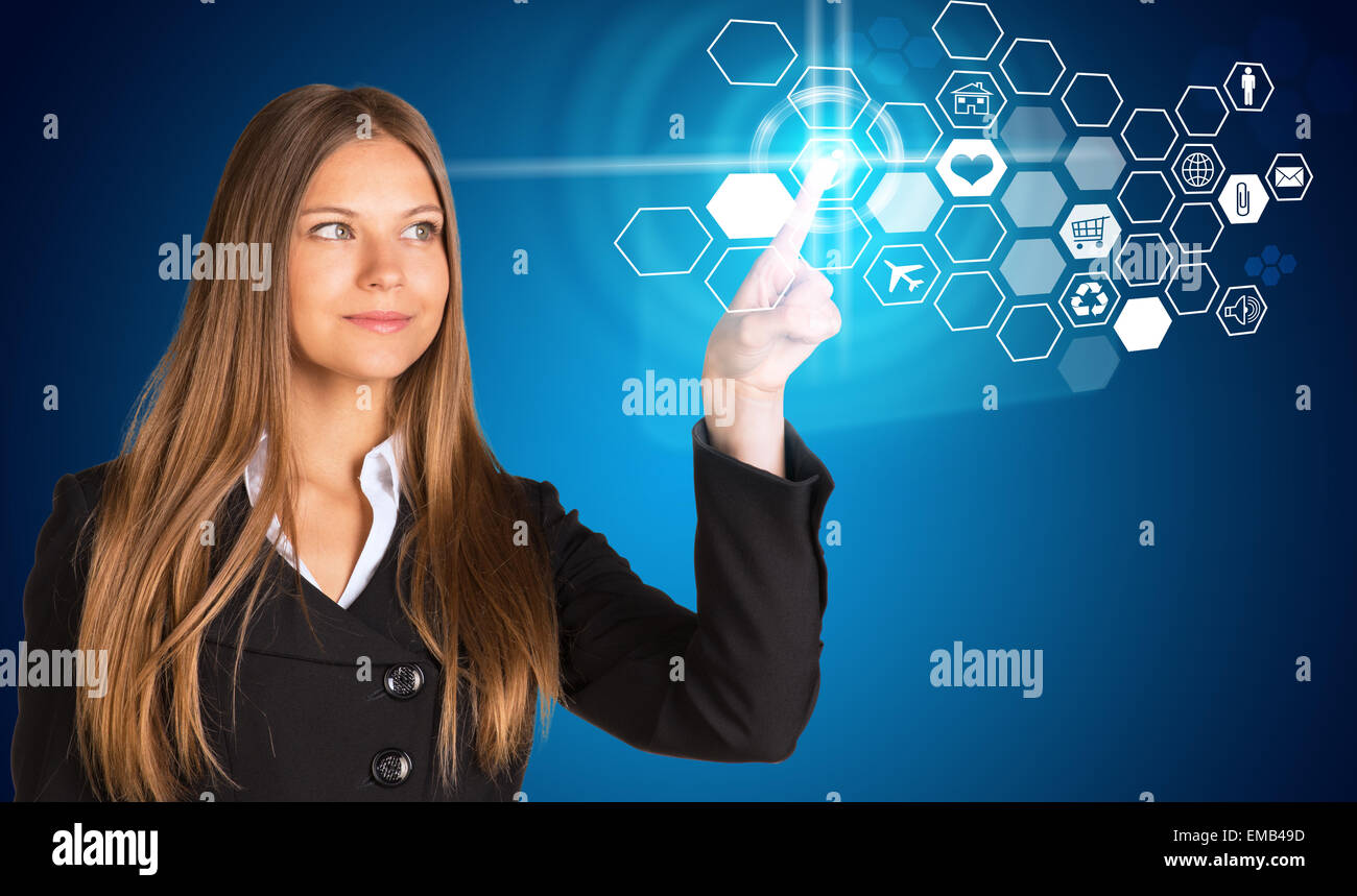 Young woman pressing button within pointer finger of left hand Stock ...