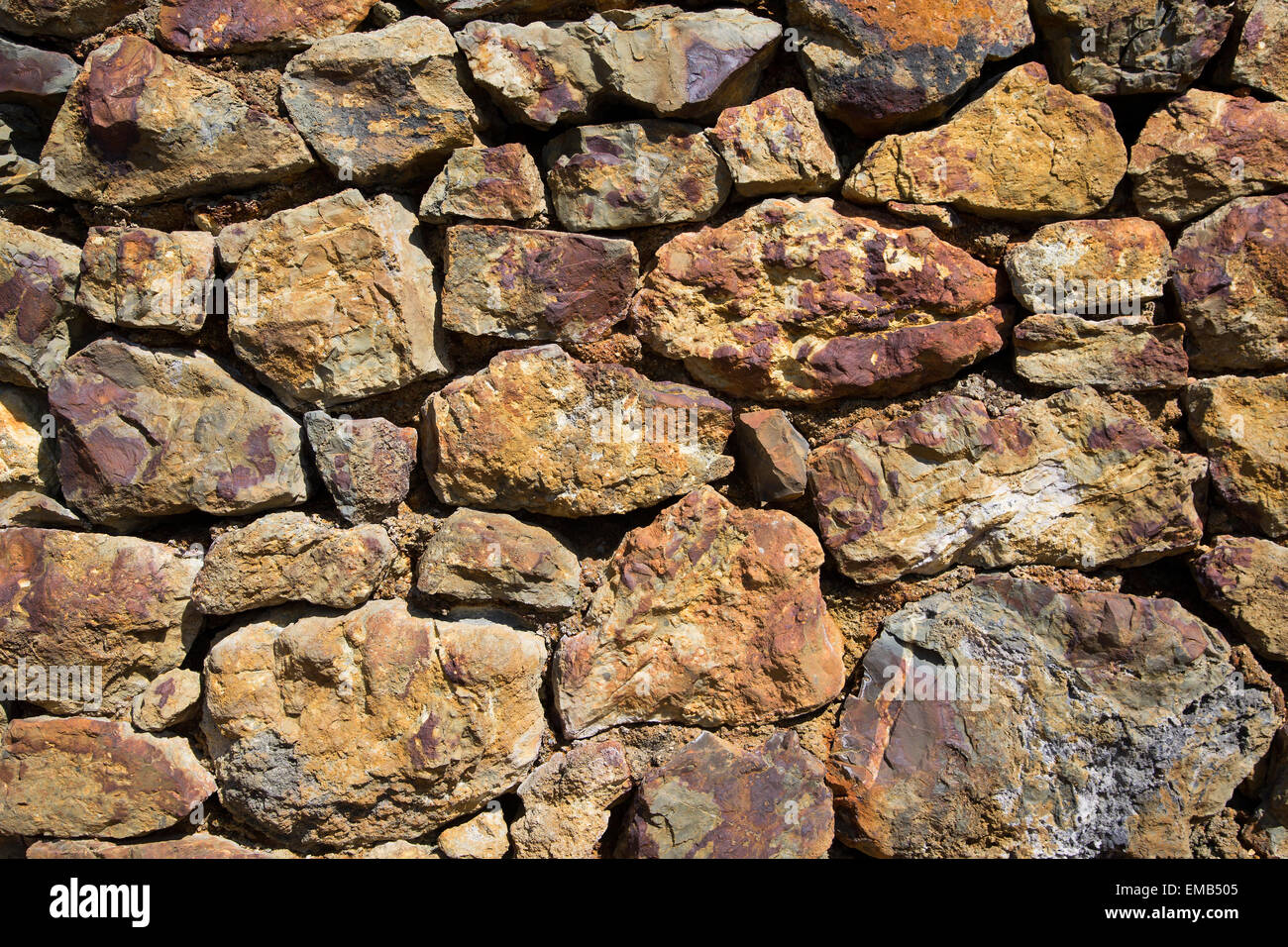 Old stone wall constructed from old copper mine stone Stock Photo - Alamy