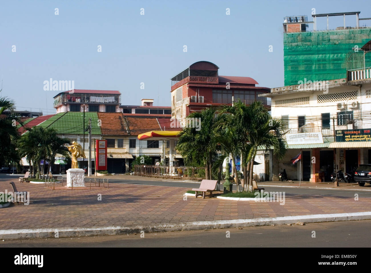 A Buddhist statue graces the center of a plaza that is part of the ...
