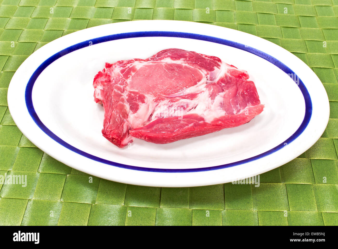 Pork neck chop meat on white plate Stock Photo - Alamy