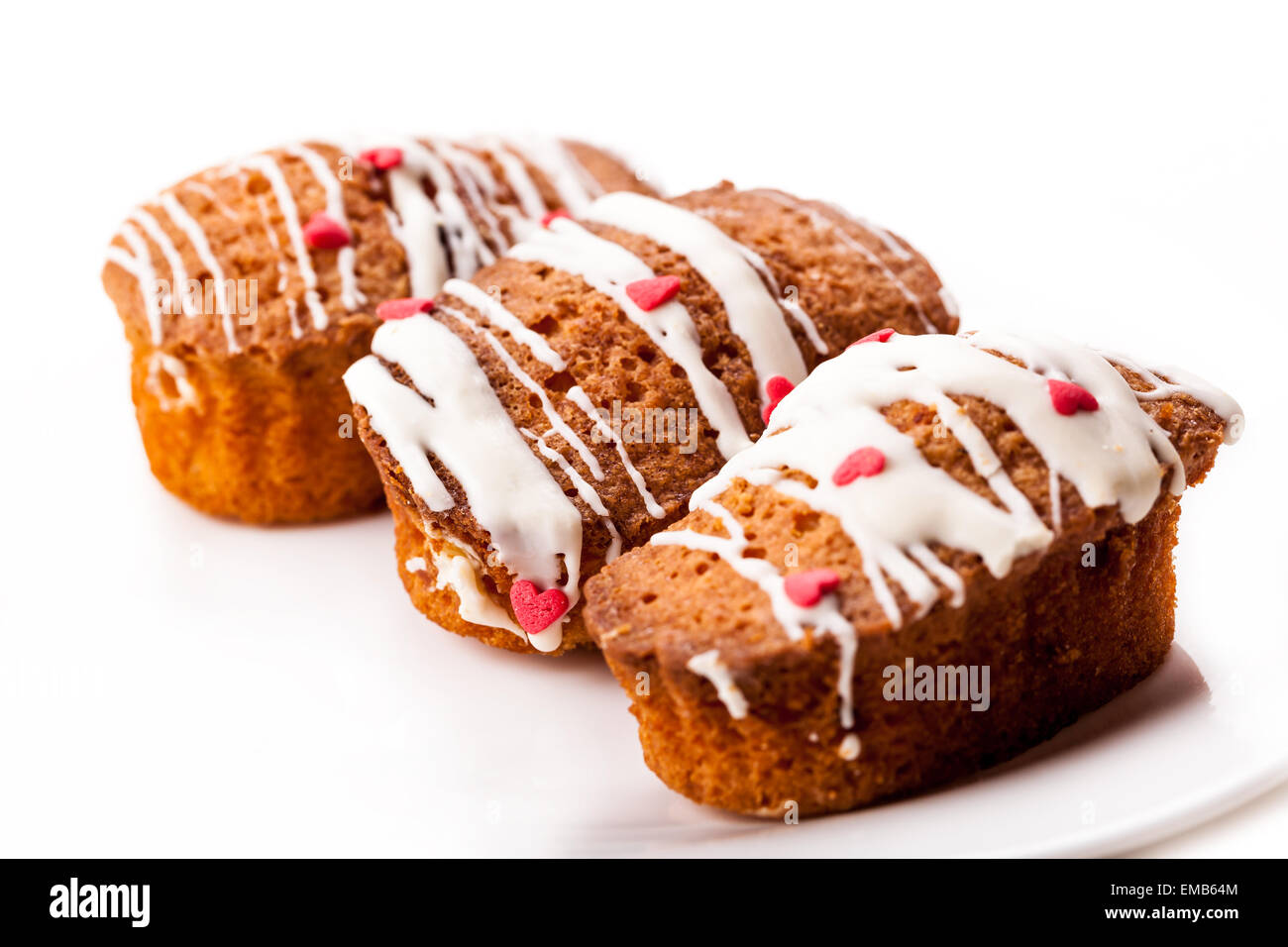 three fresh cupcake closeup on a white background Stock Photo - Alamy