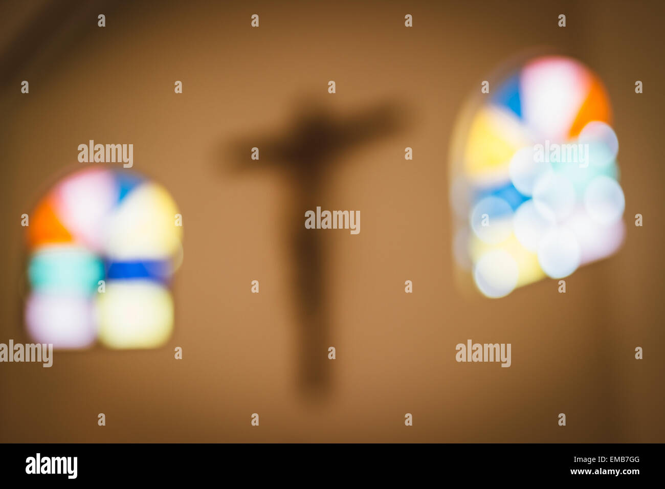 cross and stained glass window in the church blur abstract background ...