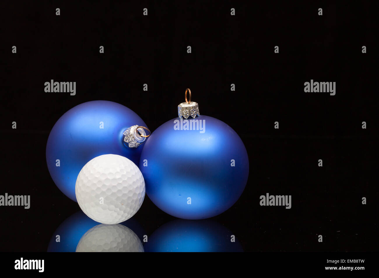 Blue Christmas decoration a golf balls on a black glass desk Stock ...