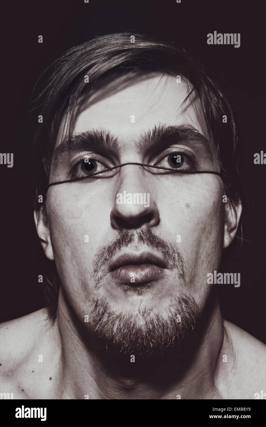Strange portrait of a young man close up Stock Photo - Alamy
