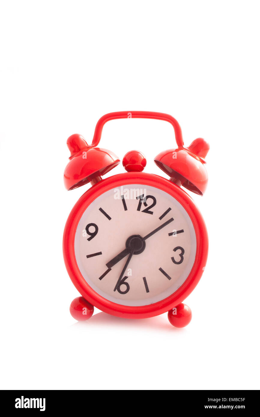 Red Alarm Clock close up isolated on a white background Stock Photo - Alamy